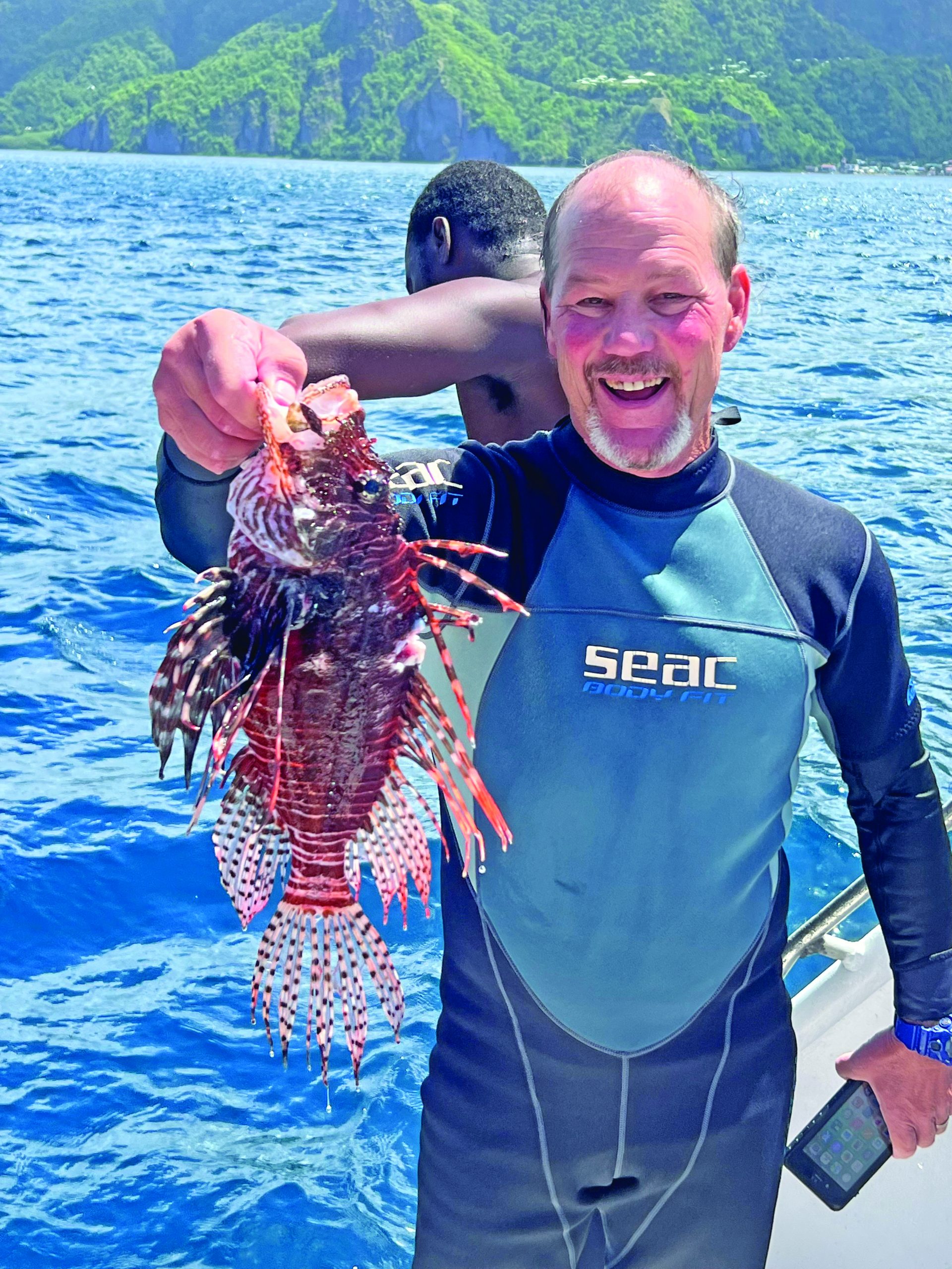 Diving family from Mathews helping with invasive lionfish—by eating ...